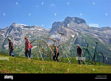 Tourists And Tour De France Bicycle Sculptures At The Mountain Pass Col
