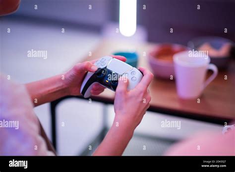 Girl Using New Sony Playstation 5 DualSense Wireless Controller Which Offers Immersive Haptic