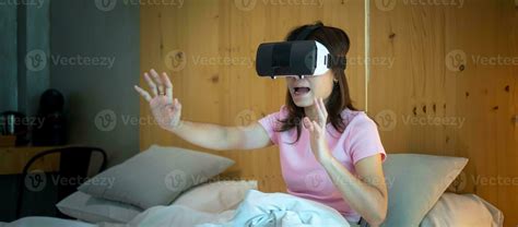 Young Woman Using Virtual Reality Headset In Bed Vr Future Digital