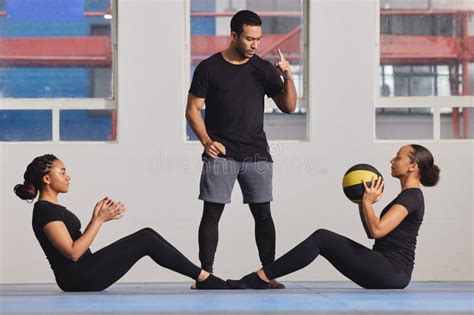 Gym Coach And Fitness Ball With Training In Class For Exercise Advice