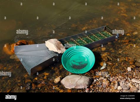 Gold Panning And Mining In Riverbed Prospecting For Gold Using Sluice