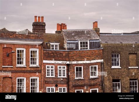Close Up Of Top Stories Of Ancient Crooked Brick Buildings In Windsor