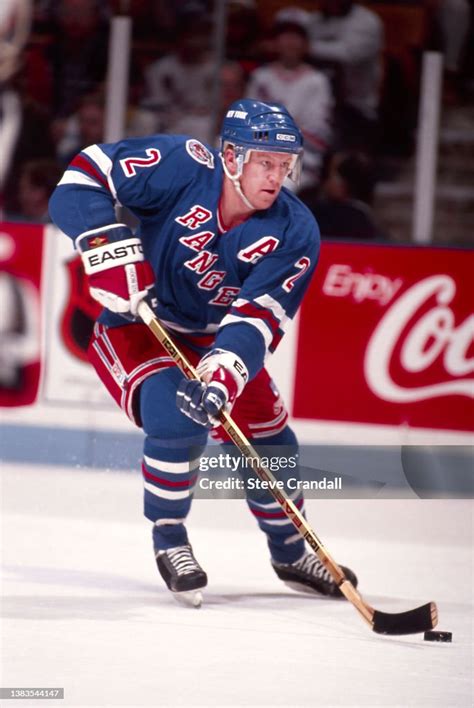Brian Leetch Of The New York Rangers Rushing The Puck Out Of The
