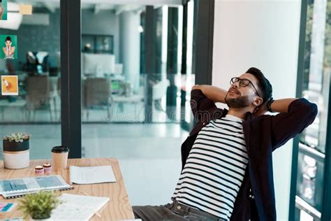 Ah What A Productive Day A Handsome Young Businessman Leaning Back In