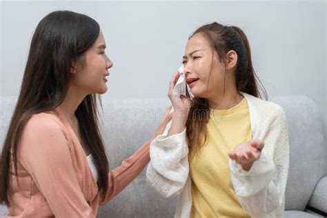 Two Women Talking About Problems At Home Asian Women Embrace To Calm
