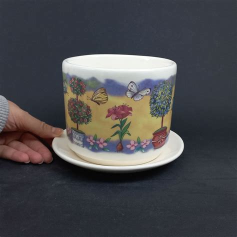 قیمت و خرید ست گلدان و زیرگلدانی سرامیکی طرح باغچه حیاط خانه مادری کد 3