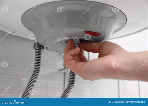 Woman Adjusting Maximum Energy Efficiency Indicator Indoors Closeup Woman Adjusting Maximum Energy Efficiency Indicator Indoors Closeup