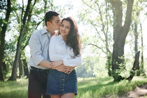 Young Couple Walking In The Forest Summer Nature Bright Sunlight