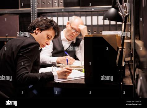 Inspectors Working Overtime At Criminal Investigations In Arhive Room