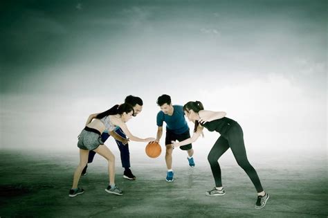 Premium Photo Group Of People Bouncing A Basketball While Training