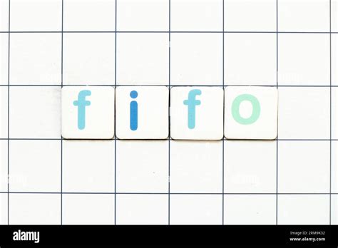 Colorful Tile Letter In Word FIFO Abbreviation Of First In First Out On White Grid Background