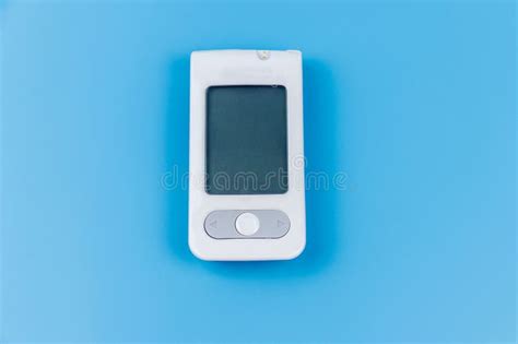 Digital Glucometer On Pastel Blue Background Diabetes Concept Stock