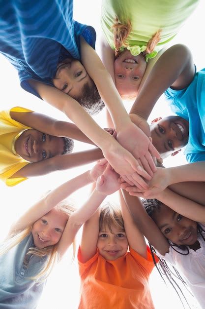 Premium Photo Cute Pupils Smiling Down At Camera Outside