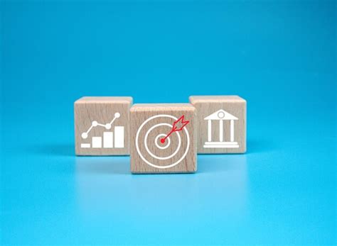 Premium Photo Wooden Block Which Prints A Target Icon And Business