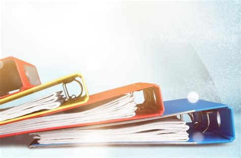 premium photo pile of files in folders and notebook