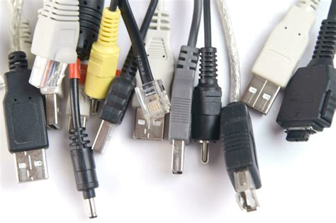 A Hand Holding Several Different Types Of Cables Stock Photo At Vecteezy