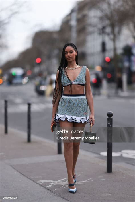 Jamilla Strand Was Seen Wearing Blue Heels A Green Skirt With Fluffy