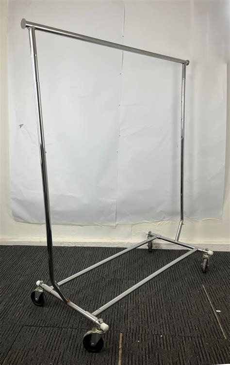 Lot Folding Clothes Rack On Wheels With Extendable Armatures