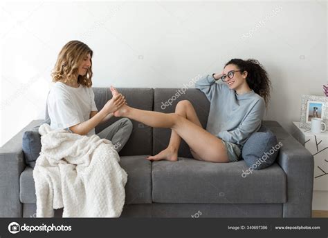 Relaxed Lesbian Couple Home One Babe Woman Giving Feet Massage Stock Photo By Dirima