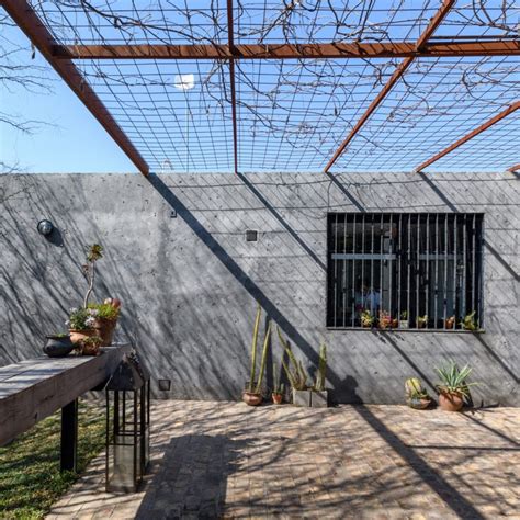 Textured Walls Enclose Maricels House In Argentina By Edgardo Marveggio