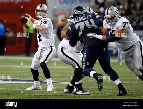 Oakland Raiders Quarterback Matt Mcgloin 14 Left Passes As Seattle