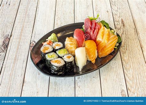 Assorted Sushi Platter With Maki Stuffed With Rice And Avocado Red