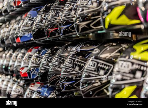 Motorcycle Helmets Line A Wall In A Motorsports Retail Store Stock