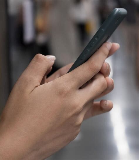 Premium Photo Close Up Of Hand Using Mobile Phone