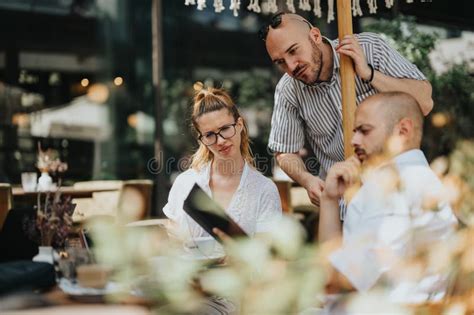 Startup Team In Business Meeting Discussing Brainstorming And Strategizing In Outdoor Setting