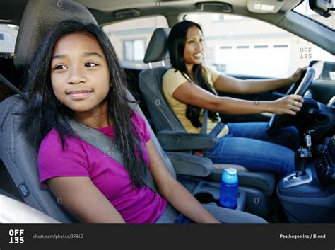 Mother And Daughter Driving In Car Stock Photo Offset