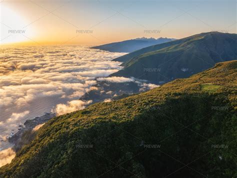 Aerial View Of Sunrise Above Clouds And Green Hills At Fanal Mountain