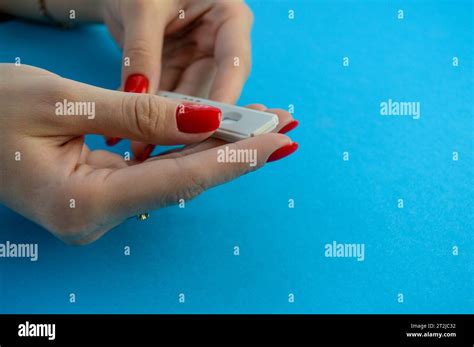 Disposable Pregnancy Test Strip Girl With Red Manicure Makes A Test To