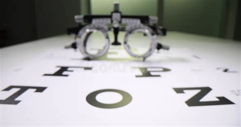 Vision Screening Device Next To Snellen Chart On Table Stock Footage Video Of Correction Test