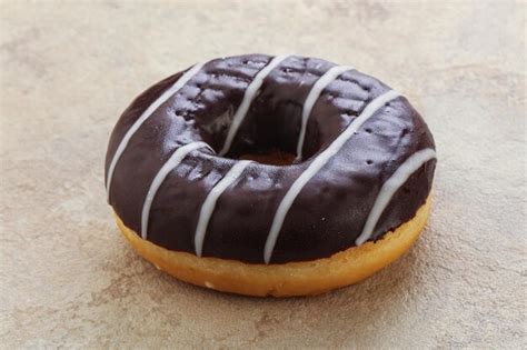Premium Photo Glazed Sweet Tasty Chocolate Icing Donut