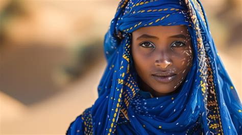 Tuareg Woman In An Authentic National Blue Dress Background With Selective Focus Premium Ai