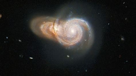 Hubble Captures Optical Illusion Of Two Spiral Galaxies Colliding