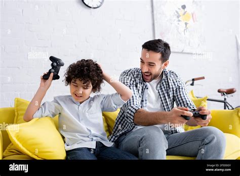 Kyiv Ukraine January 15 2021 Muslim Man Laughing Near Discouraged Son Touching Head While