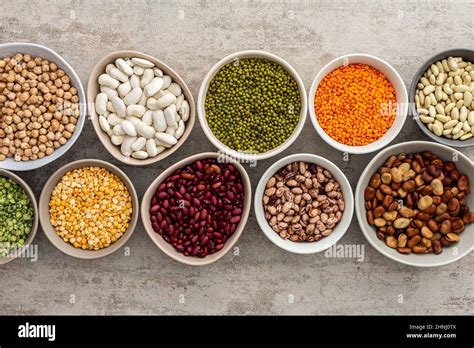 Different Types Of Legumes In Bowls Yellow And Green Peas Mung Beans