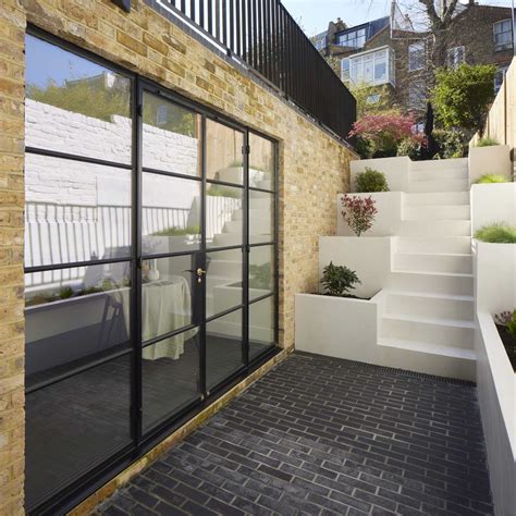 Stairs With Built In Planters Lead To The Back Garden At This Home ᐅ