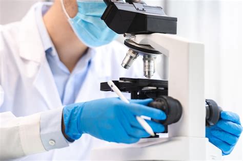 Premium Photo Scientist Analyzing Microscope Slide At Laboratory