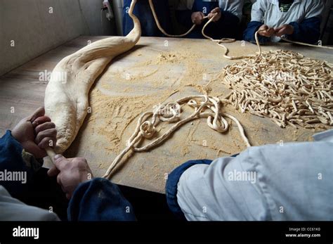 People Kneading Dough Into Strips For Making Crunchy Candy Yunnan