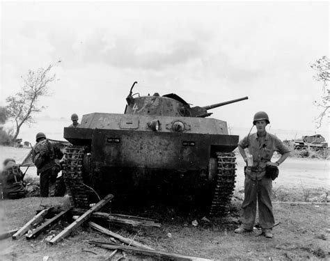 A Marine Poses Beside An Abandoned And Most Likely Knocked Out