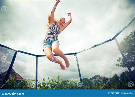 Jumping On A Trampoline Stock Image Image Of Exercise 74374921
