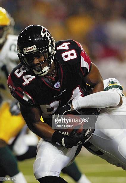 Jon Olinger Of The Atlanta Falcons Is Tackled By Erwin Swiney Of The