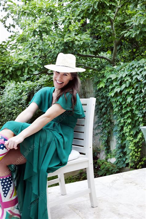 Woman Sitting On Chair In Garden Stock Image F009 3407 Science