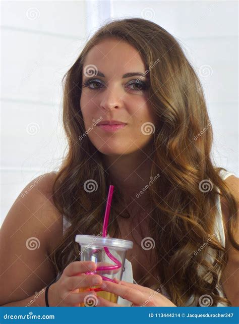 Young Women Portrait Holding Glass Of Juice Or Alcool Drink With Straw