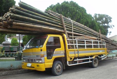 4 Trucks Are Used As A Major Transport System For Hauling Bamboo Poles