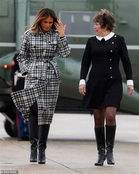Melania Trump Flies To France In A 2700 Raincoat And 1300 Boots