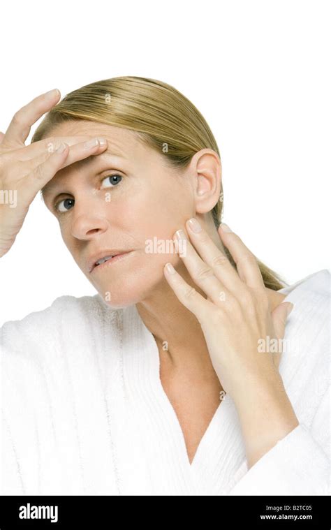 Mature Woman Examining Her Face Close Up Stock Photo Alamy