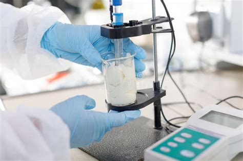 Mayonnaise Quality Testing In Laboratory With Scientist Using Texture Analyzer And Professional